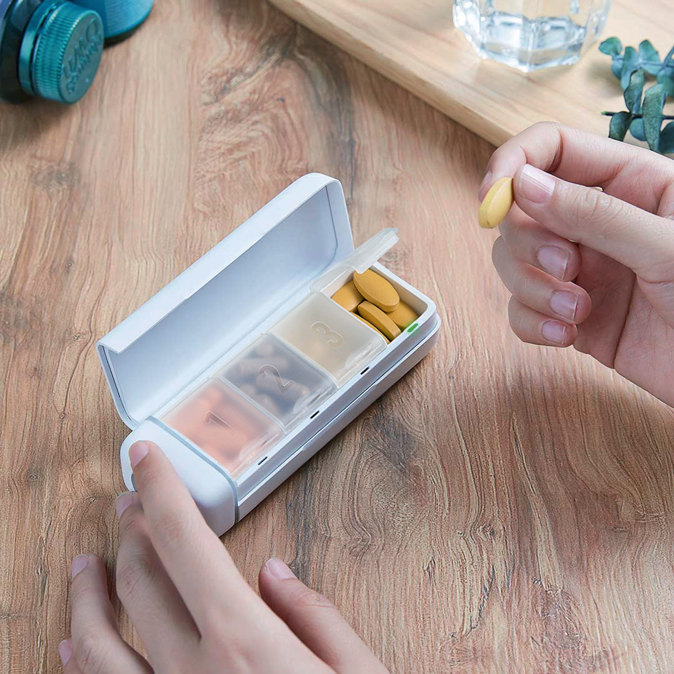 Bluetooth LE connected pill dispenser/organizer reminds users to take ...
